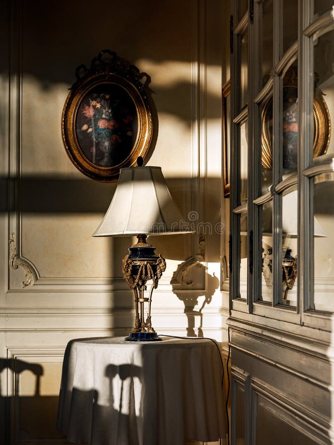 The Rich Interior of the Palace. Beautiful Table Lamp , Sunny Shadows ...
