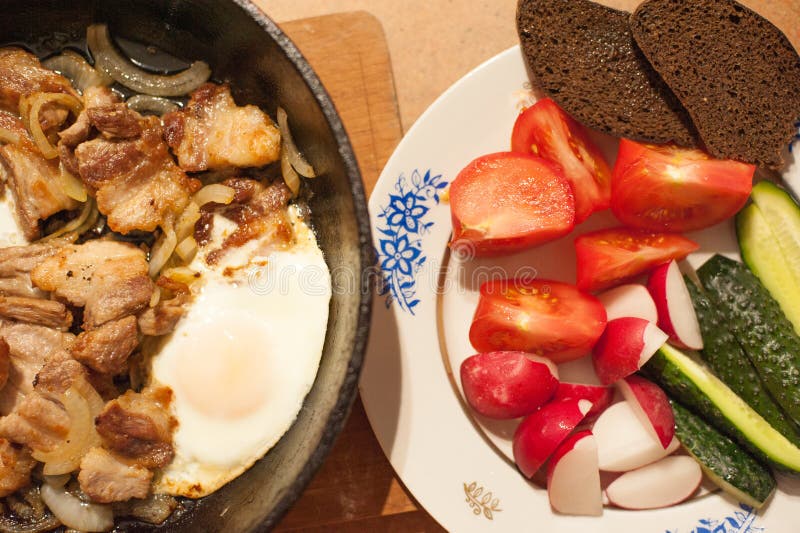 Rich Rustic Breakfast. Rural Food, Fried Egg Pork and Fresh Vegetables ...