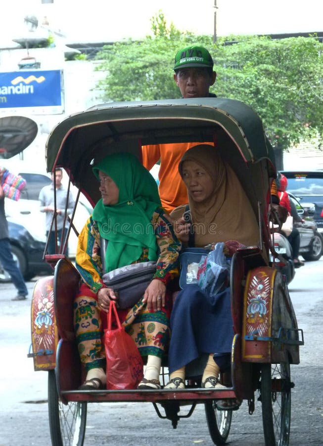 Ricksaw editorial image. Image of city, indonesia, passengers - 68861610
