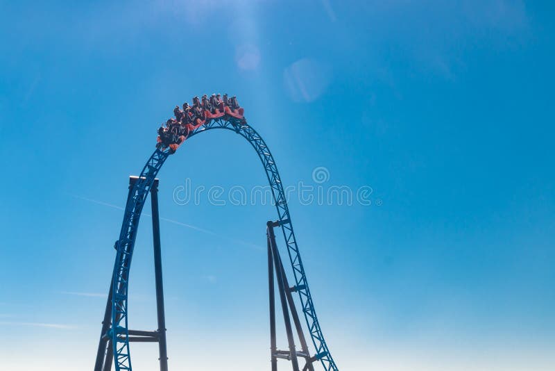 Ride Roller Coaster in Blurred Motion on Sky Background in Amusement ...