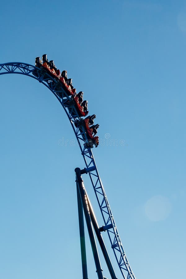 Ride Roller Coaster in Blurred Motion on Sky Background in Amusement ...