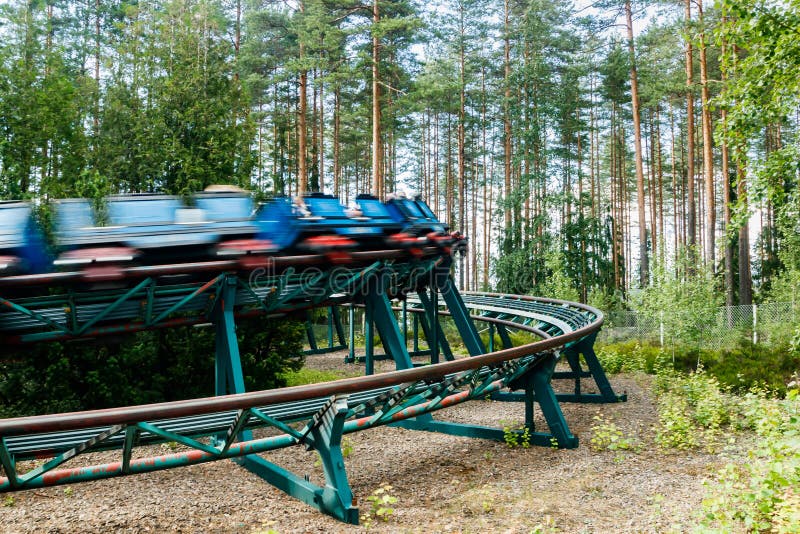 Ride Roller Coaster in Motion in Amusement Park at Summer Day Stock ...