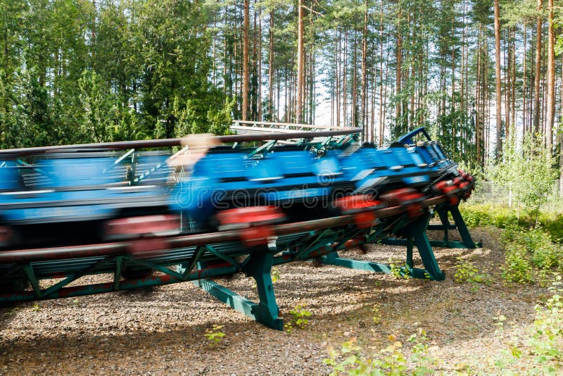 Ride Roller Coaster in Motion in Amusement Park at Summer Day Stock ...