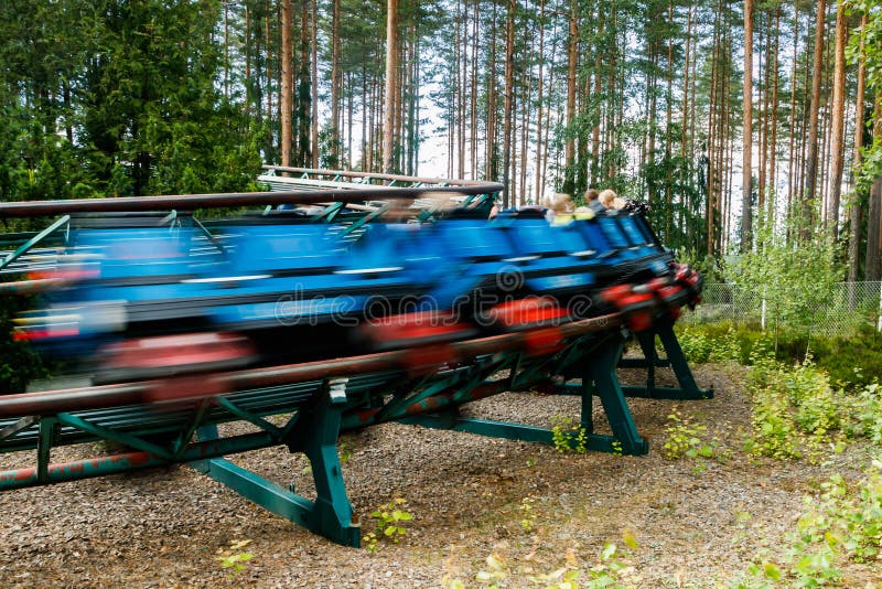 Ride Roller Coaster in Motion in Amusement Park at Summer Day Stock ...