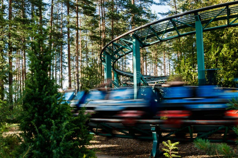 Ride Roller Coaster in Motion in Amusement Park at Summer Day Stock ...