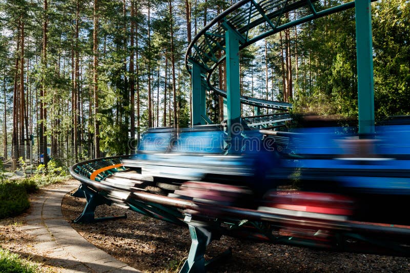 Ride Roller Coaster in Motion in Amusement Park at Summer Day Stock ...