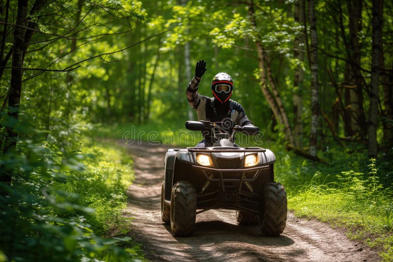 Rider on an Atv Waving at the Camera on a Forest Path Stock Image ...
