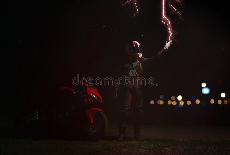 The Rider in the Gear and the Helmet Touches the Flash of Lightning ...