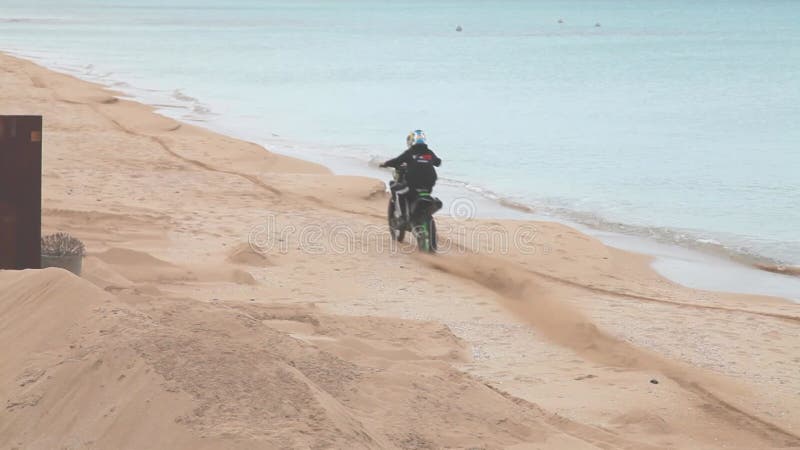 Rider Rides a Motorcycle on the Beach Stock Video - Video of motorcycle ...