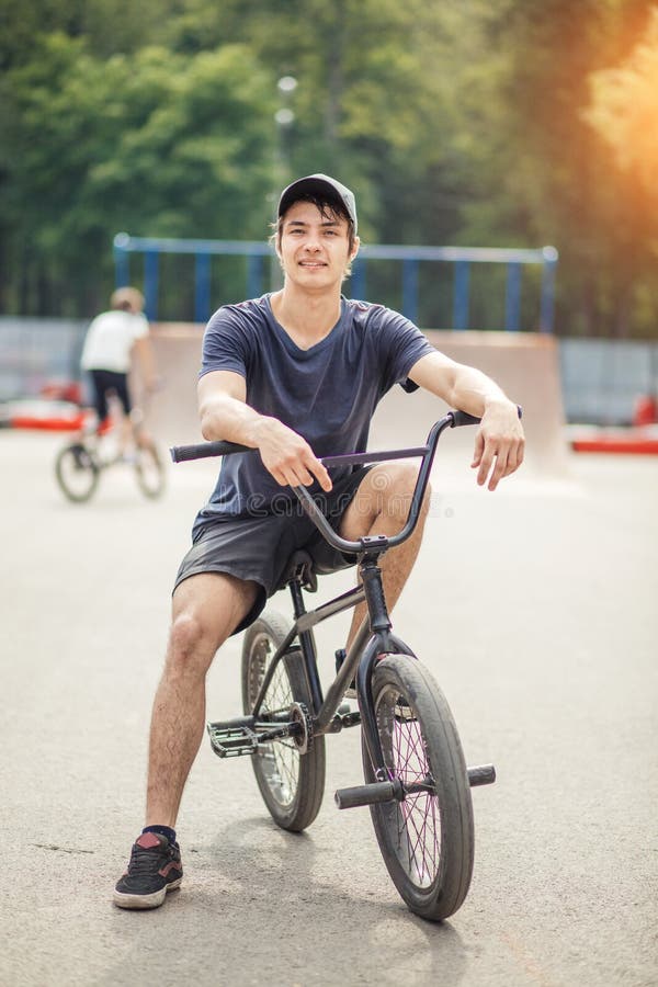 Rider Sitting on BMX in Skate Park Resting after Riding Stock Photo ...