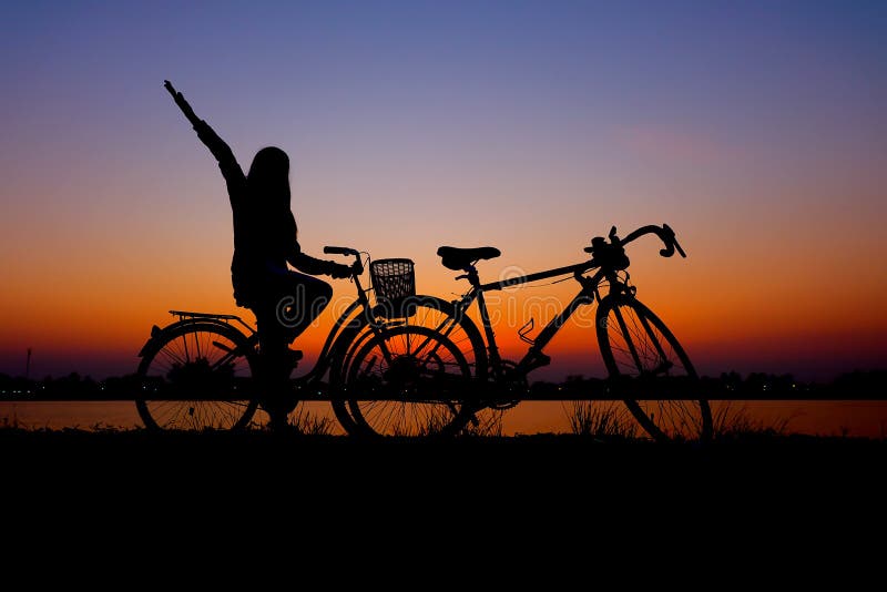 Riders Cycling Against Sunset in Silhouette with Lots of Negative Space ...