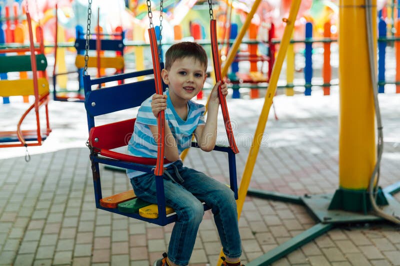 Rides Children S Swing Boy Rides on a Merry-go-round Stock Image ...
