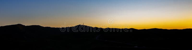 Ridge of a Mountain Range Against a Background of Blue Sky at Sunset ...
