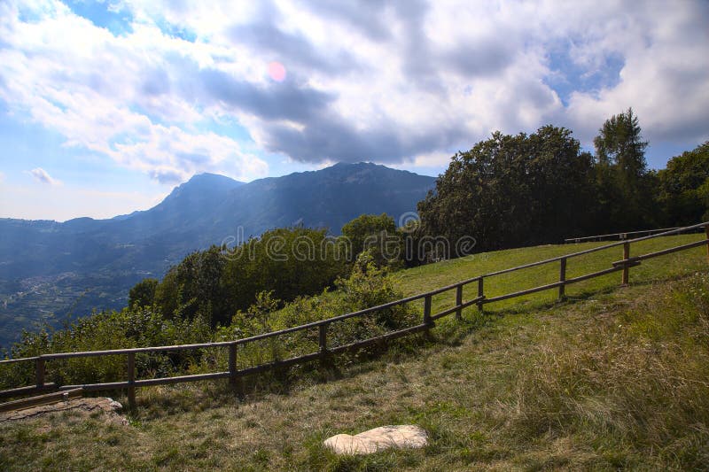 Ridge of a Mountain with a Wooden Railing and Trees of a Forest in the ...