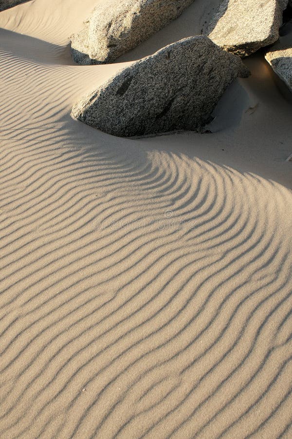 Ridges Created by the Wind in a Sandy Beach are Seen with Rocks. Stock ...