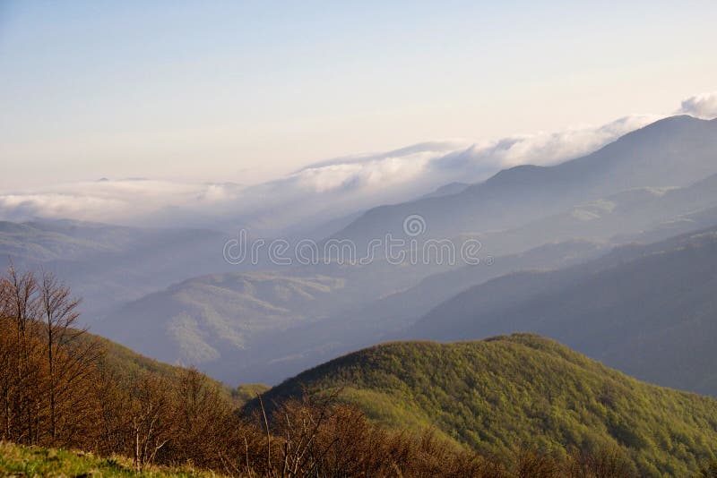 Ridges of the Hills in the Clouds at Sunset Stock Photo - Image of ...