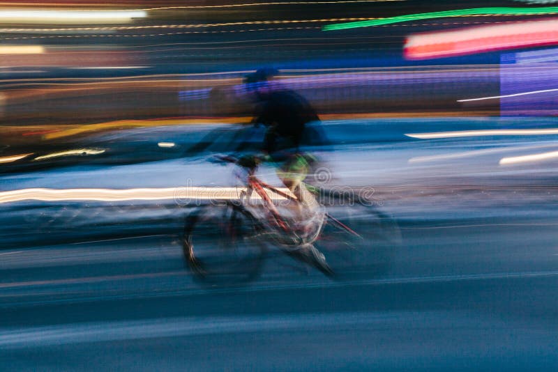 Riding a Bicycle in a Blurred City Scene Stock Image - Image of motion ...