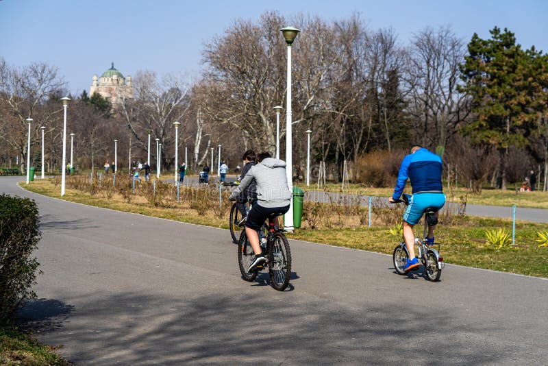 Riding a Bicycle on the City Streets. Commute To Work in Bucharest ...