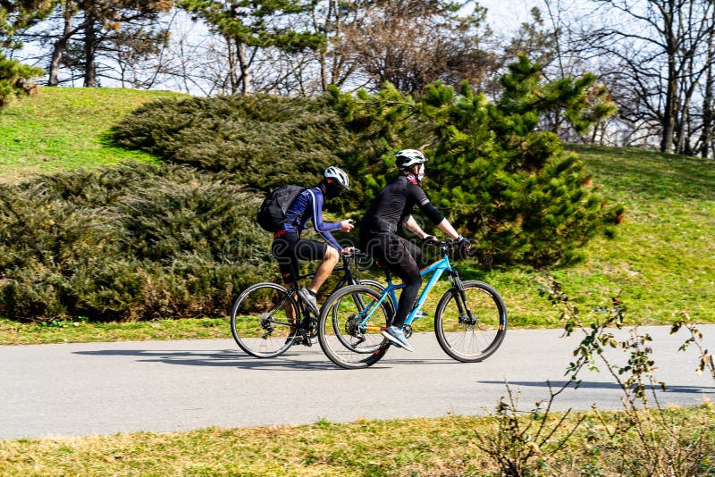 Riding a Bicycle on the City Streets. Commute To Work in Bucharest ...