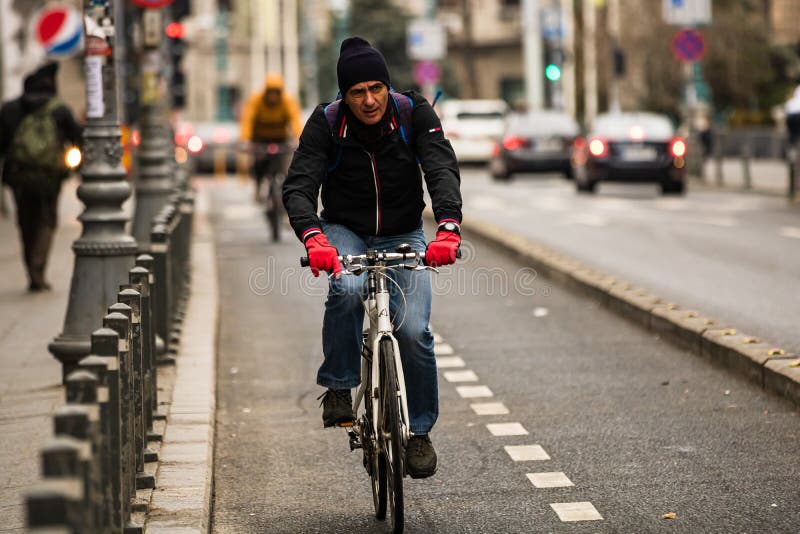 Riding a Bicycle on the City Streets. Commute To Work in Bucharest ...