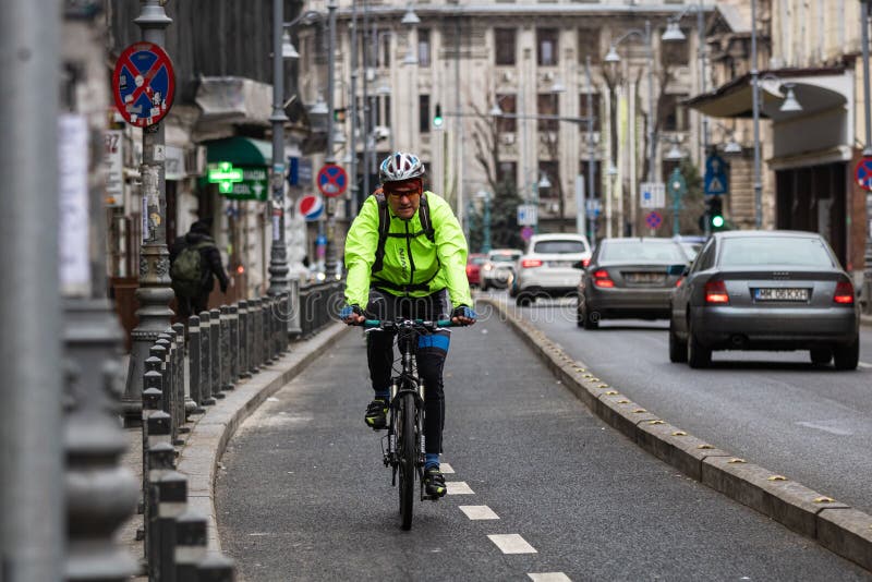 Riding a Bicycle on the City Streets. Commute To Work in Bucharest ...