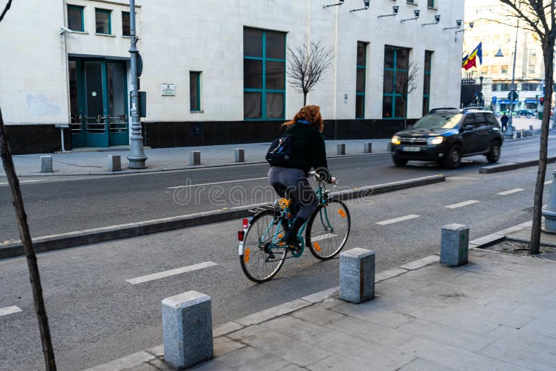 Riding a Bicycle on the City Streets. Commute To Work in Bucharest ...
