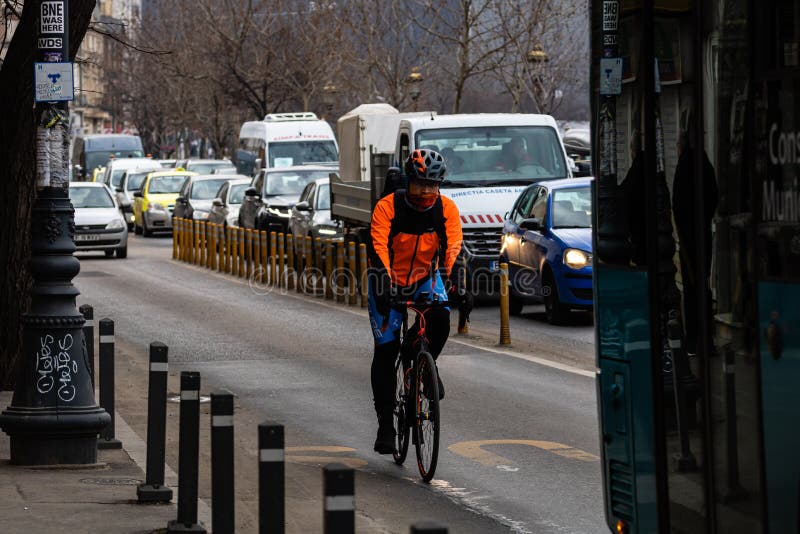 Riding a Bicycle on the City Streets. Commute To Work in Bucharest ...
