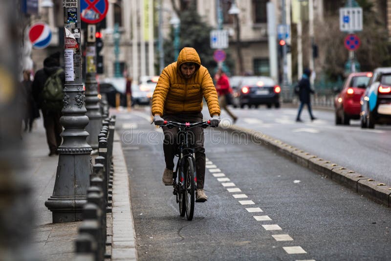 Riding a Bicycle on the City Streets. Commute To Work in Bucharest ...
