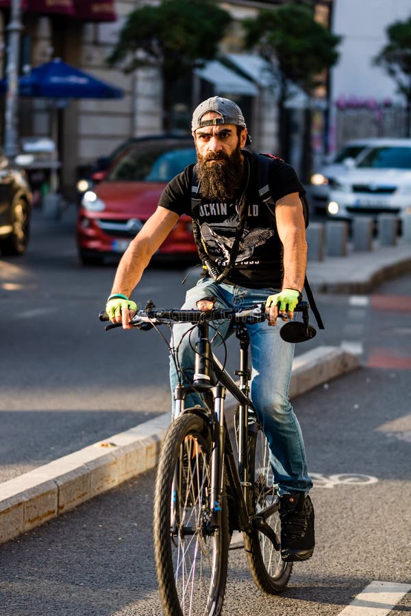Riding a Bike. Commuters on Bike in Bucharest, Romania, 2021 Editorial ...