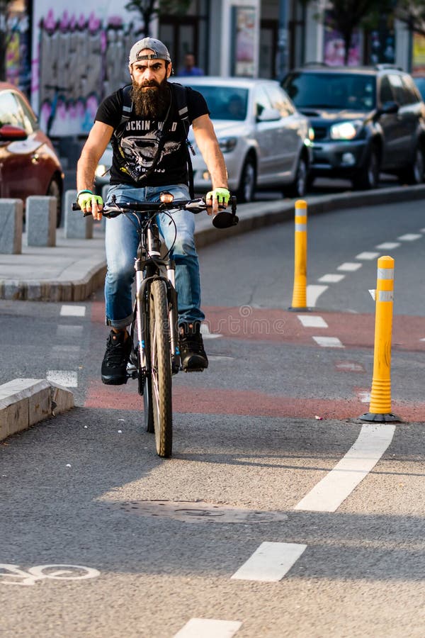 Riding a Bike. Commuters on Bike in Bucharest, Romania, 2021 Editorial ...