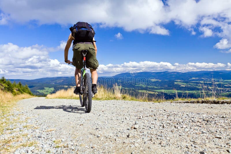 Riding a bike in mountains stock photo. Image of activity - 21012642