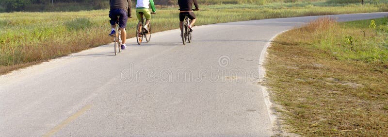 Riding a bike on road stock image. Image of bicycles - 37088377