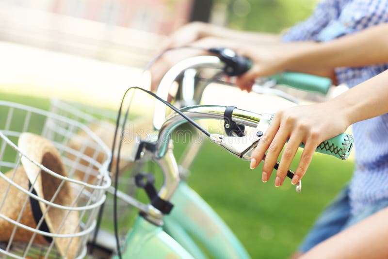 Riding bikes in the park stock image. Image of hand, couple - 41164035