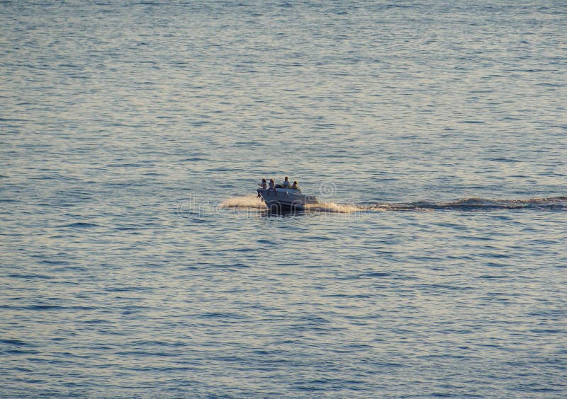 Riding on an Electric Boat on the Calm Seawater Surface Stock Photo ...