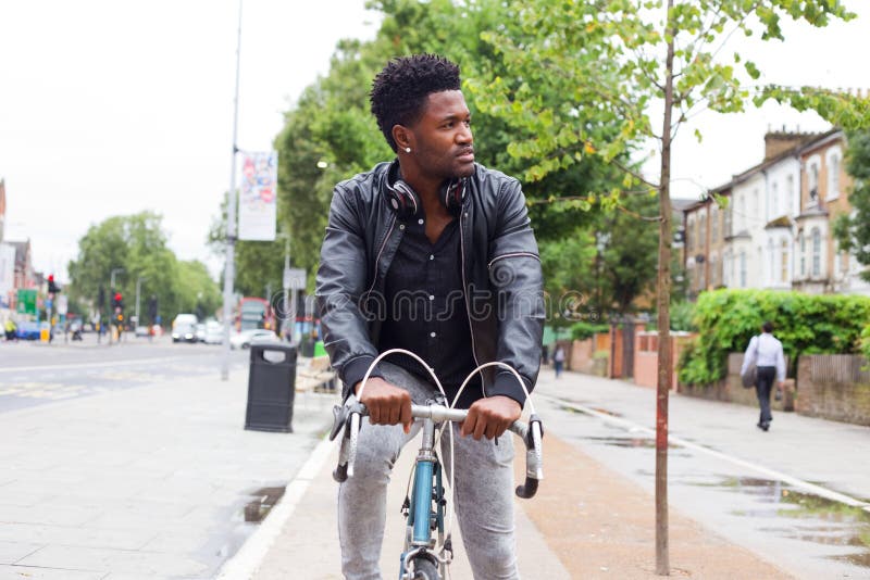 Riding his bike stock image. Image of candid, cycling - 76255879