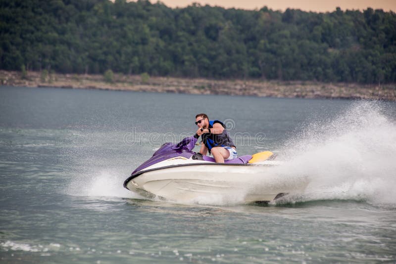Riding a Jet ski. stock image. Image of summer, water - 41667847