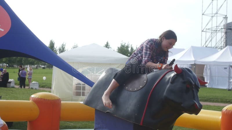 Riding a Mechanical Bull. Slow Motion Stock Video - Video of funny ...