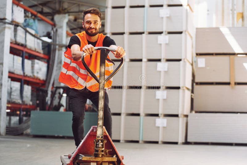 Riding the Platform Trolley. Storage Worker is in the Warehouse with ...