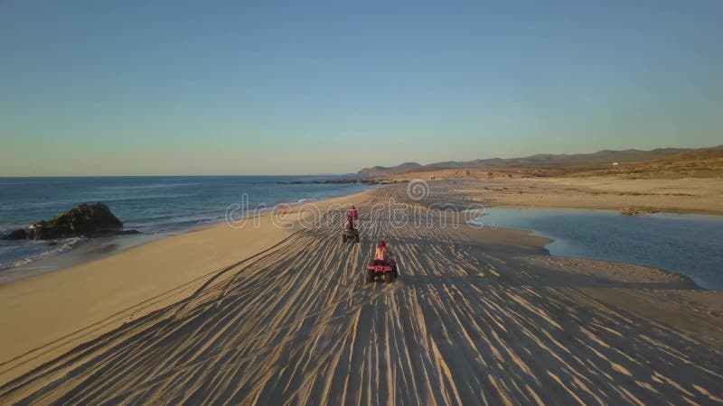 Riding Quad on Beach Sand. Group of People with ATV Activity Stock ...