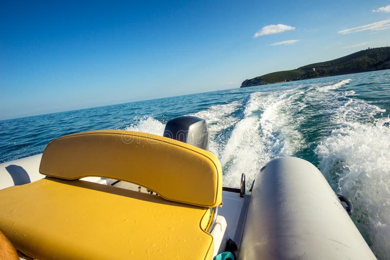 Riding on RIB boat stock image. Image of skies, back - 80569443