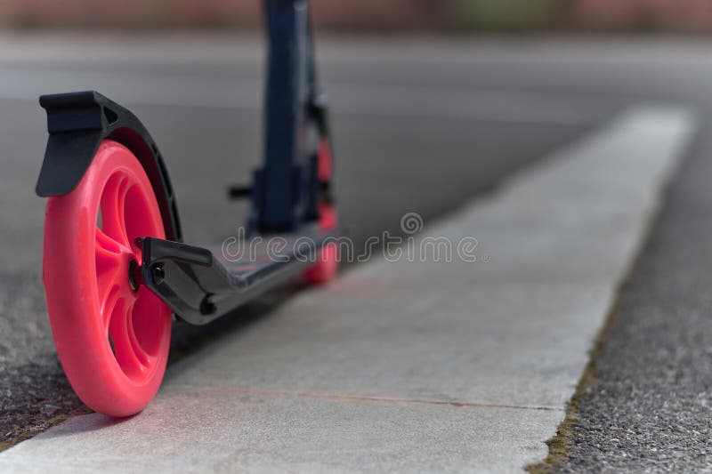 Riding in a Straight Line: Scooter Next To White Line on Street. Stock ...