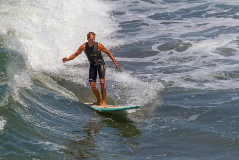 Riding a Wave editorial stock image. Image of wave, action - 82355344
