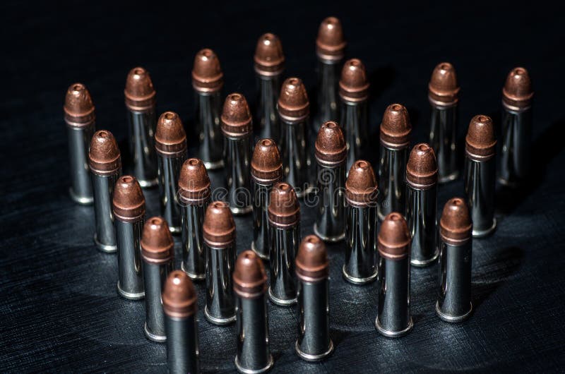 Rifle bullets over table stock image. Image of macro - 67661063