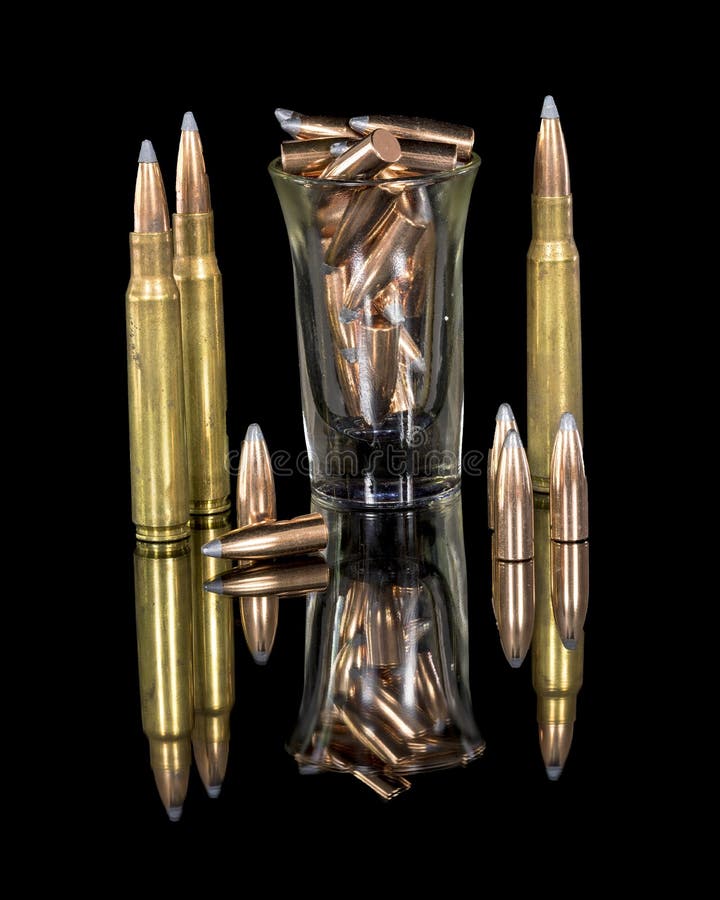 Rifle Bullets with Some Tips in a Shot Glass Stock Photo - Image of ...