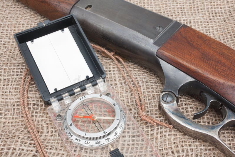 Rifle and Compass stock image. Image of antique, sport - 64786419