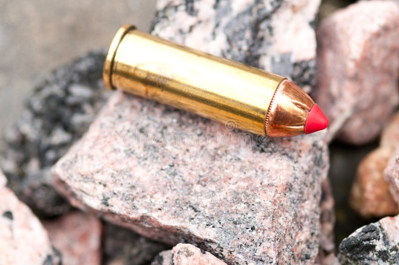 Magnum Bullet with a Red Tip Stock Photo - Image of metal, closeup ...