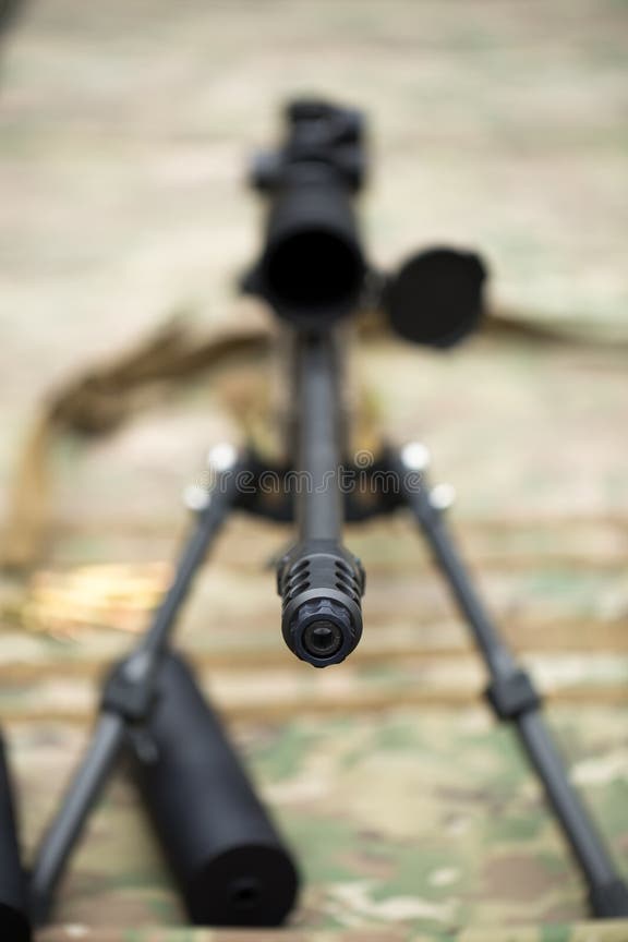 A Rifle with a Silencer on the Ground. Stock Photo - Image of automatic ...