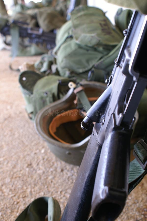 A Rifle and a Soldier Helmet Stock Image - Image of army, troops: 2134299
