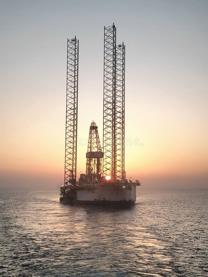 Rig Move and Sunset at Sea Offshore Stock Photo - Image of sunset, move ...