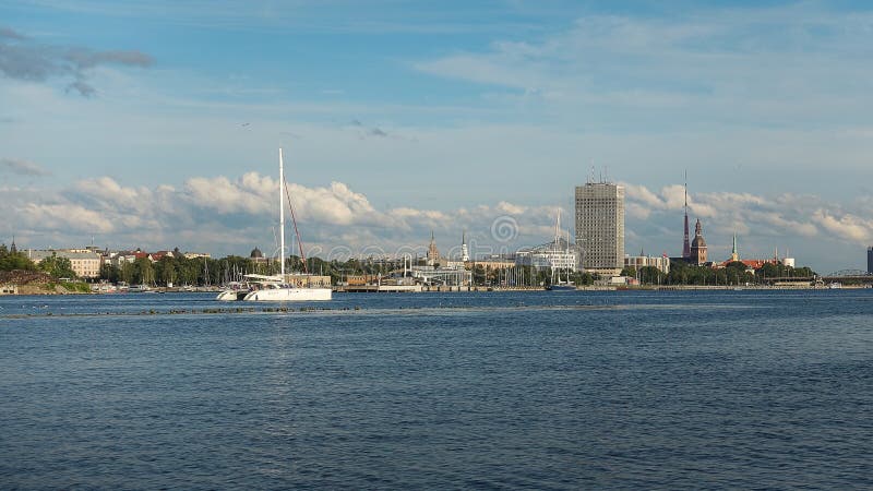 Riga Landscape Across the Blue Waters of the Daugava River Stock Photo ...